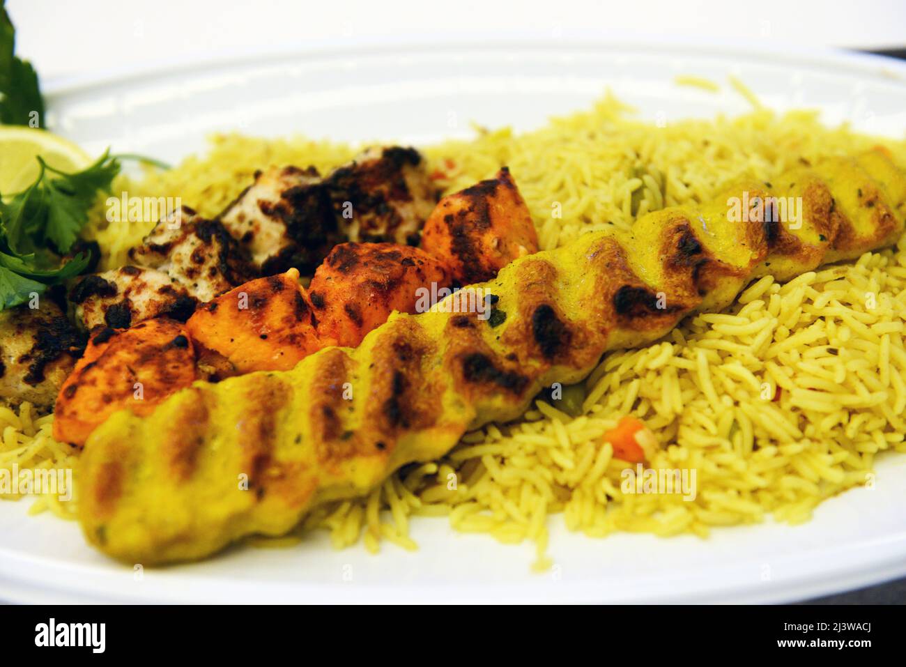 Shish Kebabs on Yellow rice Stock Photo - Alamy