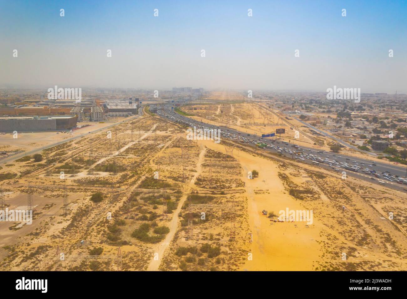 Aerial view of residential district and E311 motorway in Dubai city at ...
