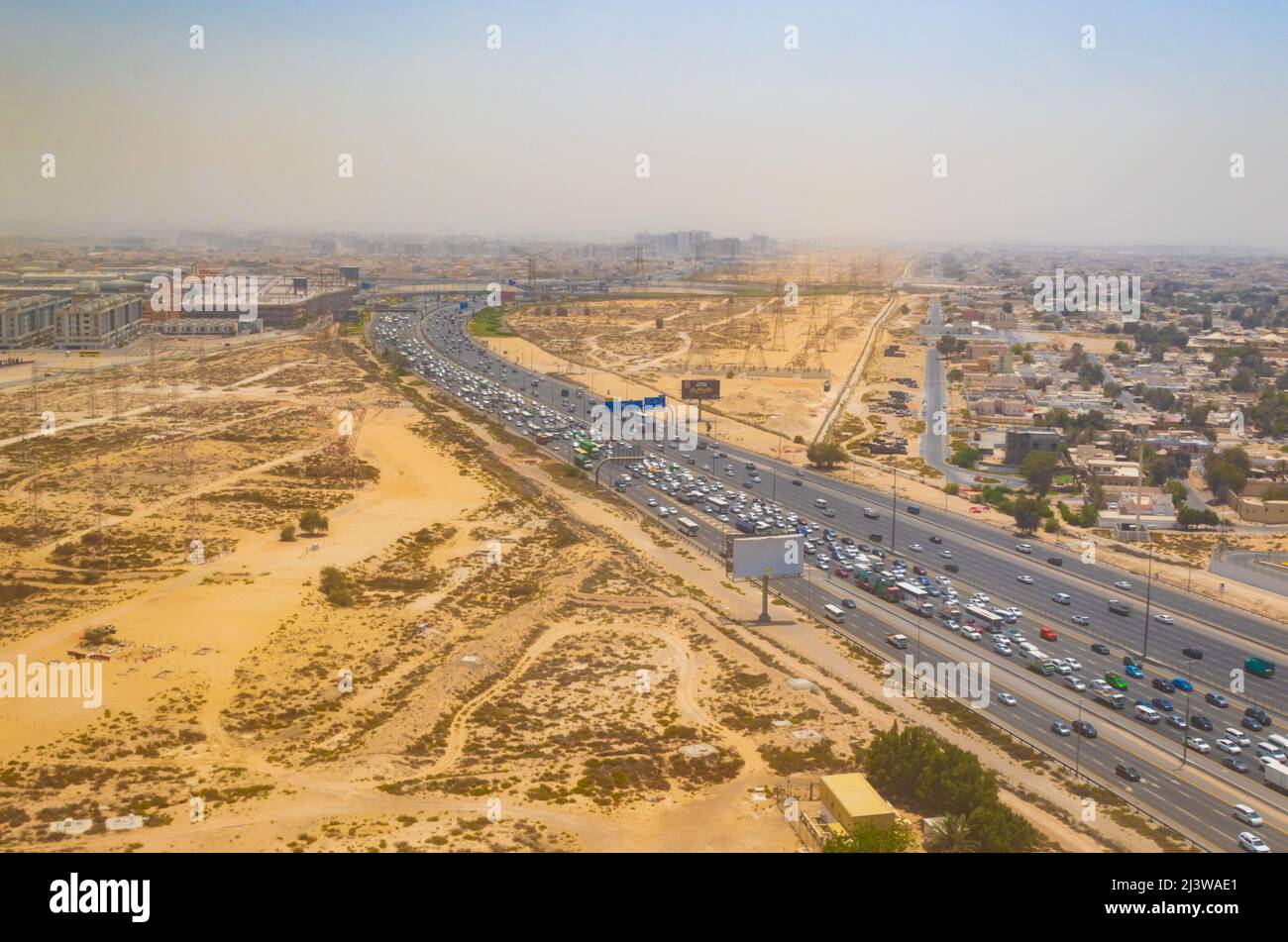 Aerial view of residential district and E311 motorway in Dubai city at ...