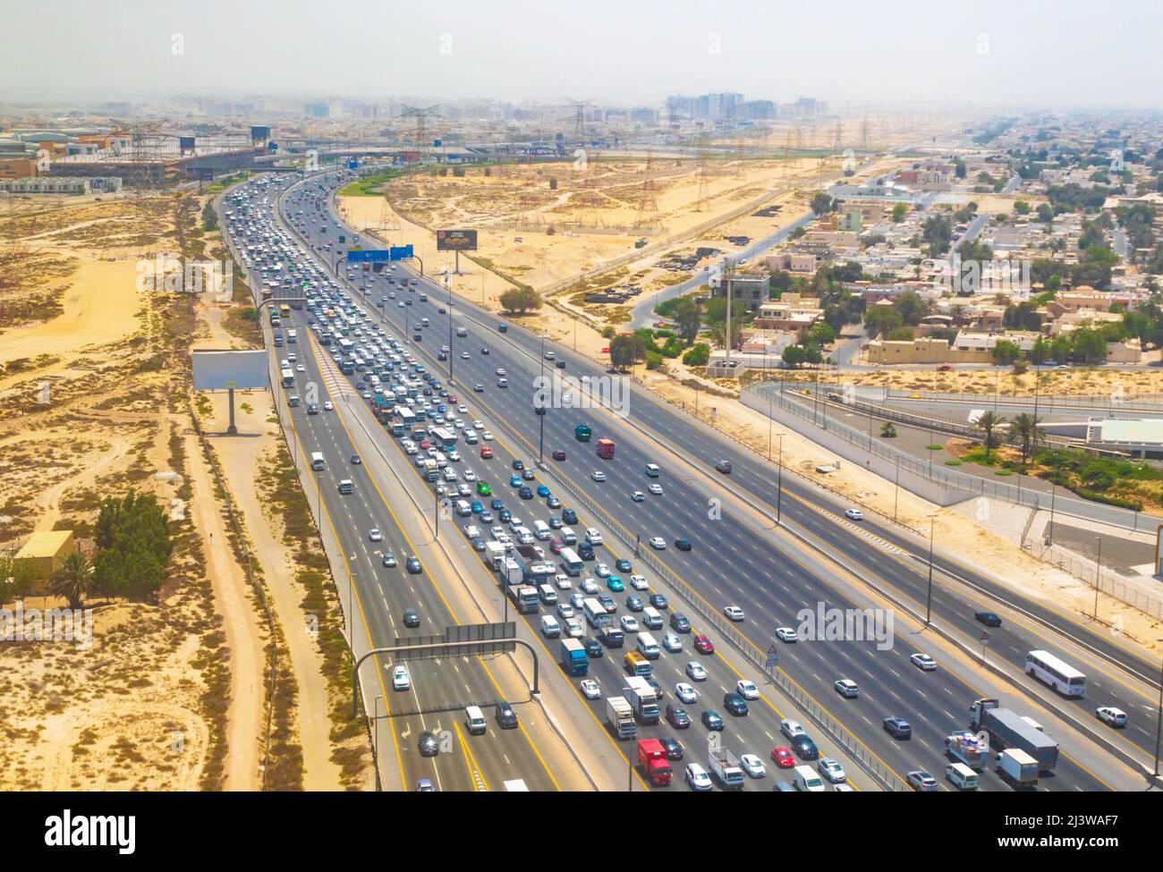 Aerial view of residential district and E311 motorway in Dubai city at ...