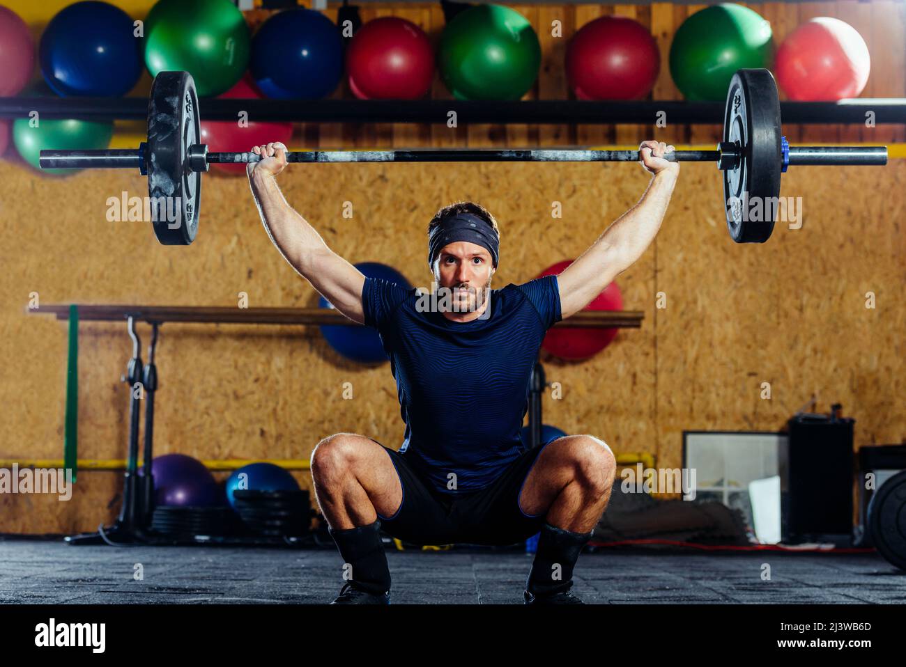 Strong man is having gym workout routine Stock Photo - Alamy