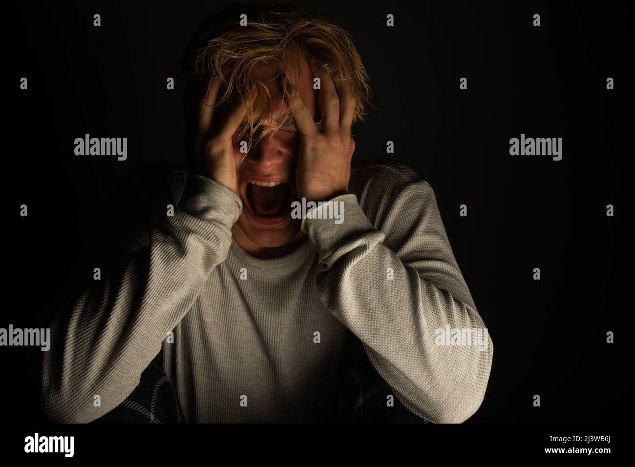 Portrait of broken boy screaming his pain out of his chest Stock Photo ...