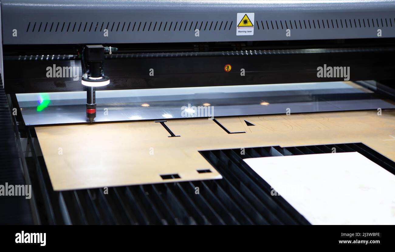 Digital die cutter machine cutting plastic acrylic. Industrial ...