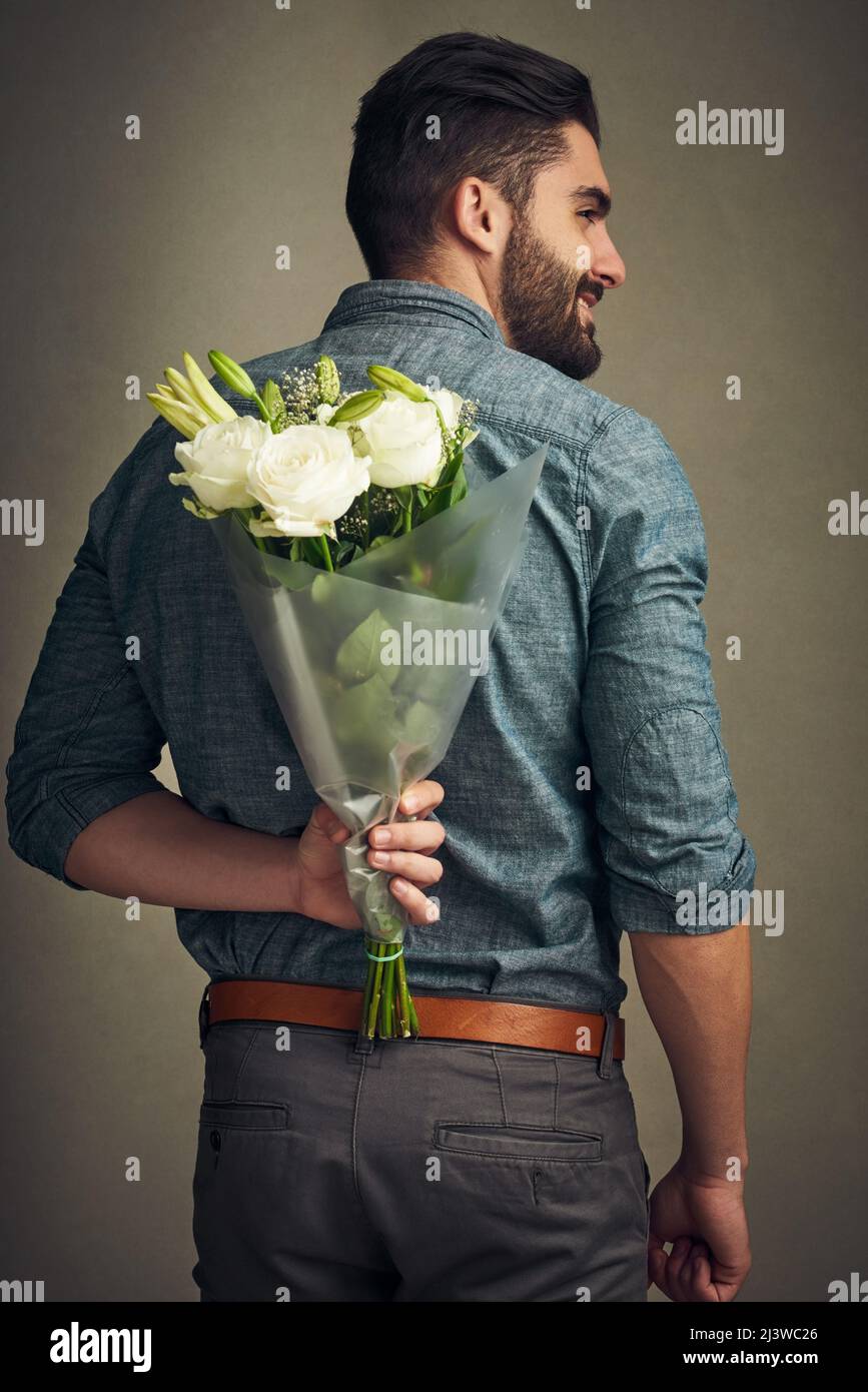 She deserves to feel special. Studio shot of a handsome young man ...