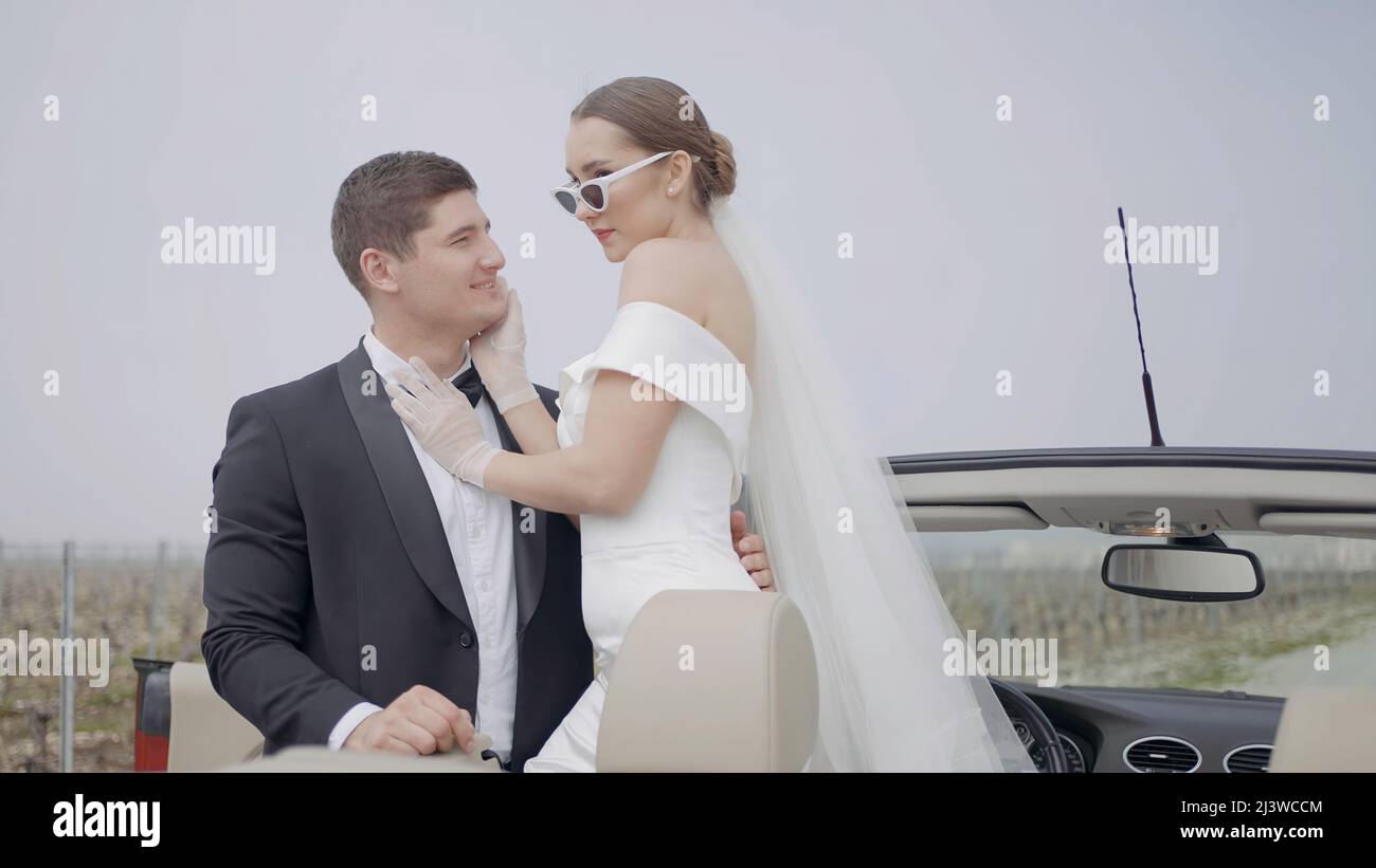 Just married couple, bride and groom in the open air. Action. Beautiful ...