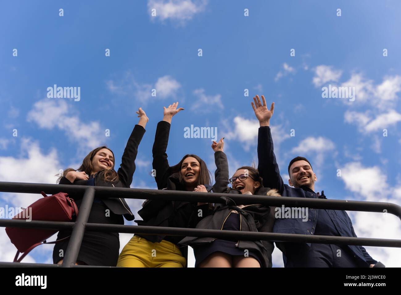 Group of amazing and young business people are happy, low angle Stock ...