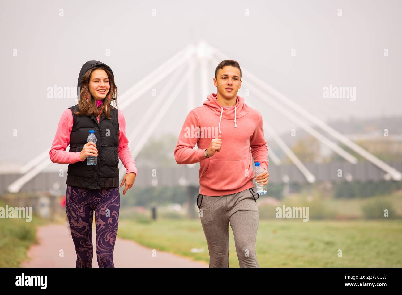 Attractive adn amazing friends are running together and relaxing while ...
