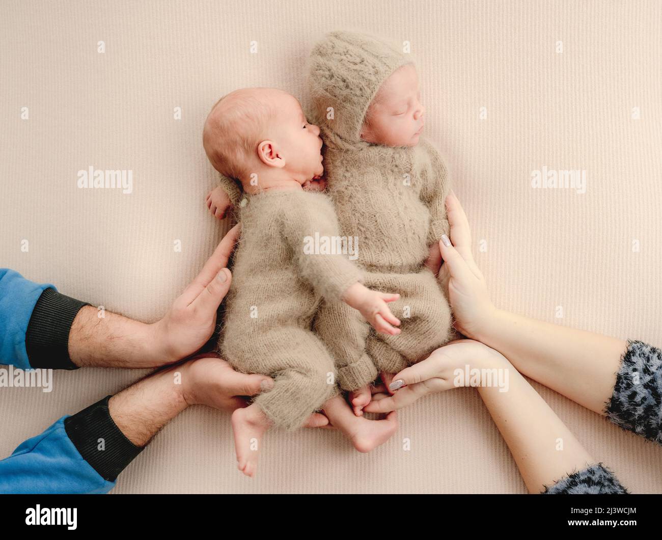 Twins hand hi-res stock photography and images - Alamy