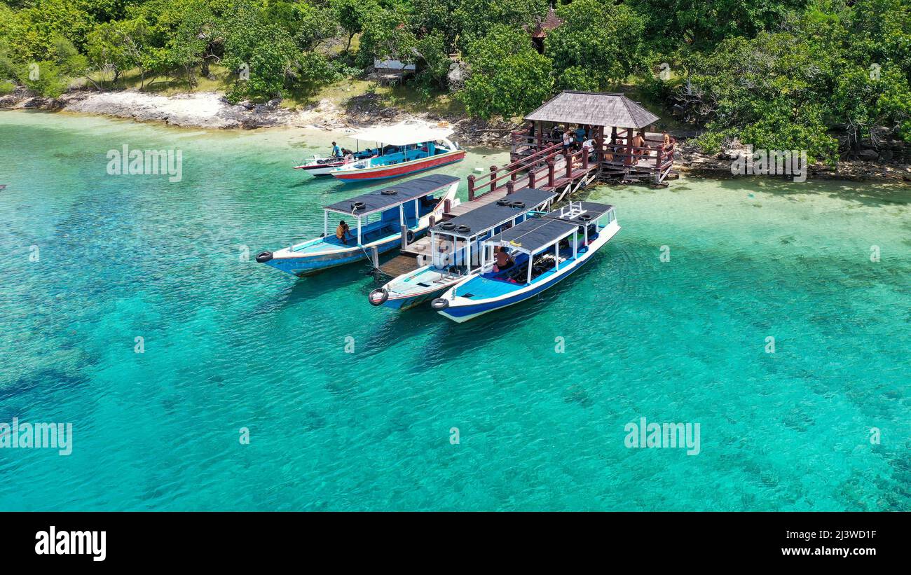 A boat parked next to the shore on Menjangan Island, Bali, Indonesia ...