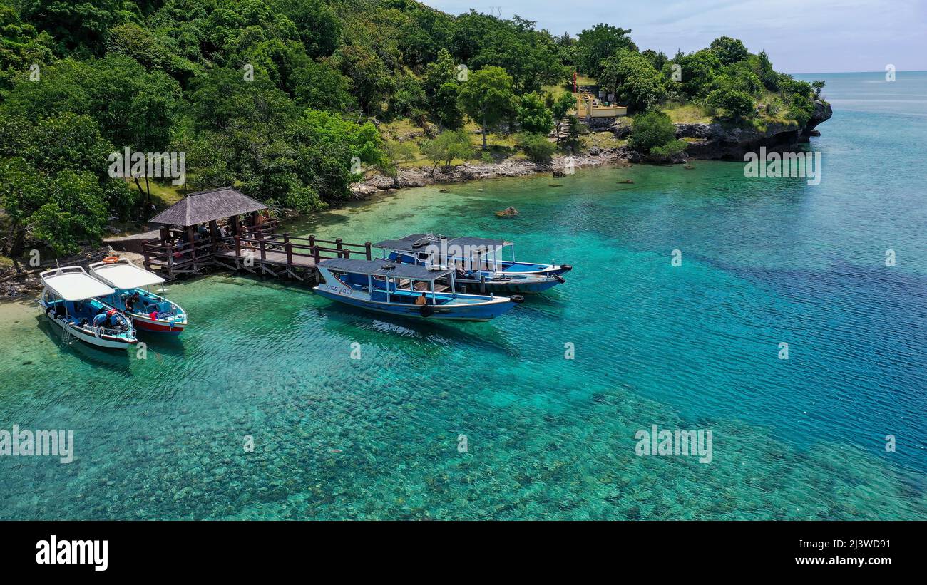 A boat parked next to the shore on Menjangan Island, Bali, Indonesia ...