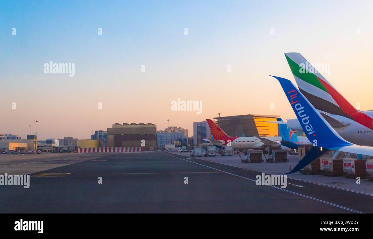 Sunset over Dubai International Airport runway,UAE Stock Photo - Alamy