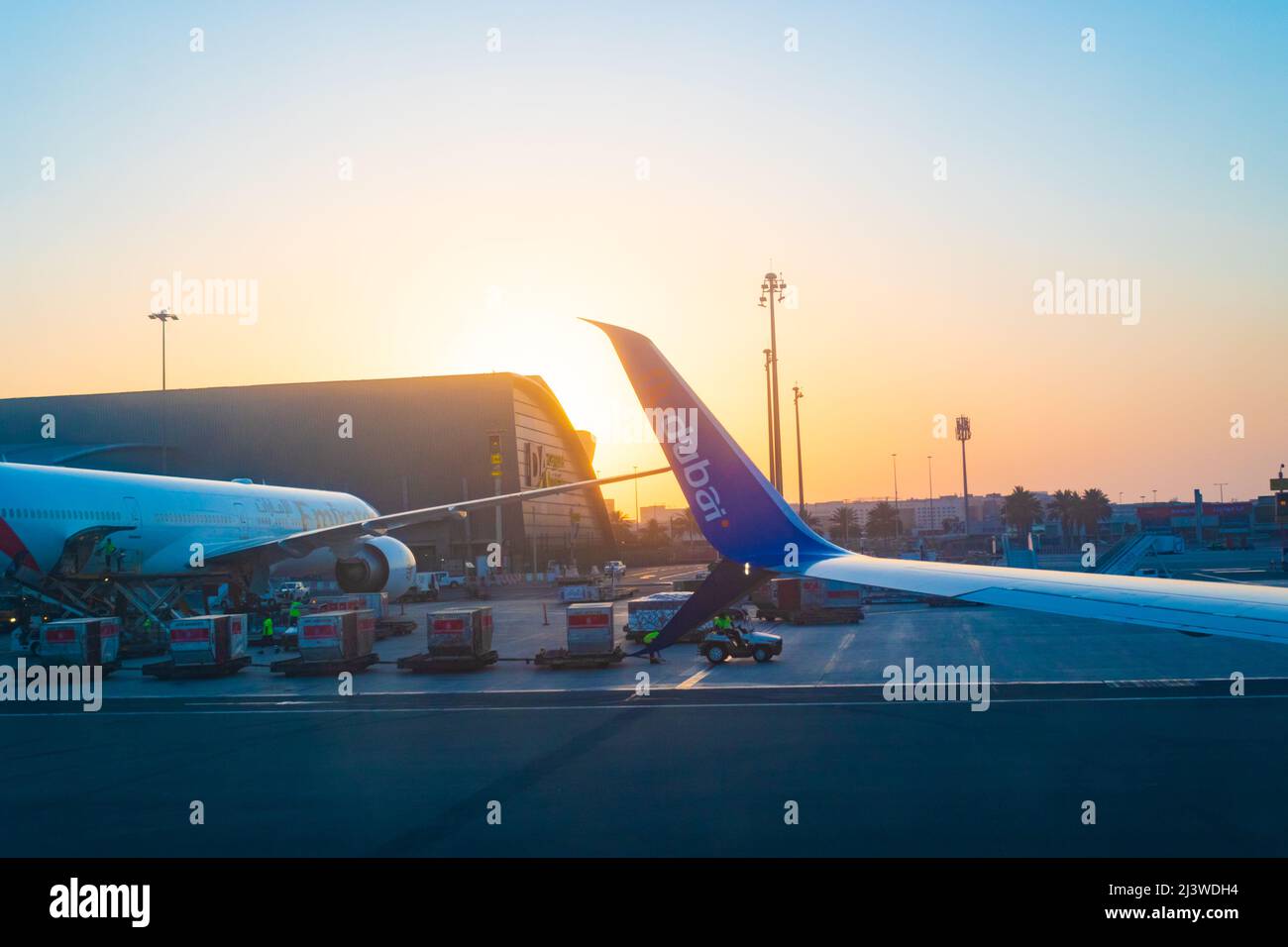 Sunset over Dubai International Airport runway,UAE Stock Photo - Alamy
