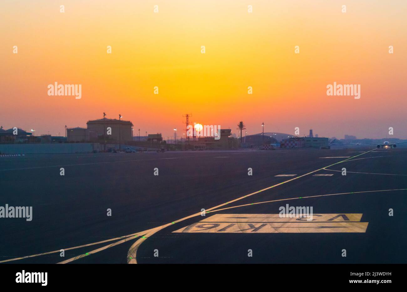 Sunset over Dubai International Airport runway,UAE Stock Photo - Alamy
