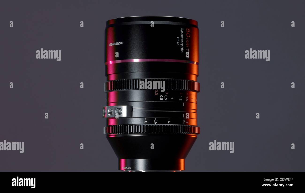A huge camera lens. Action. A large portrait lens that rotates around ...