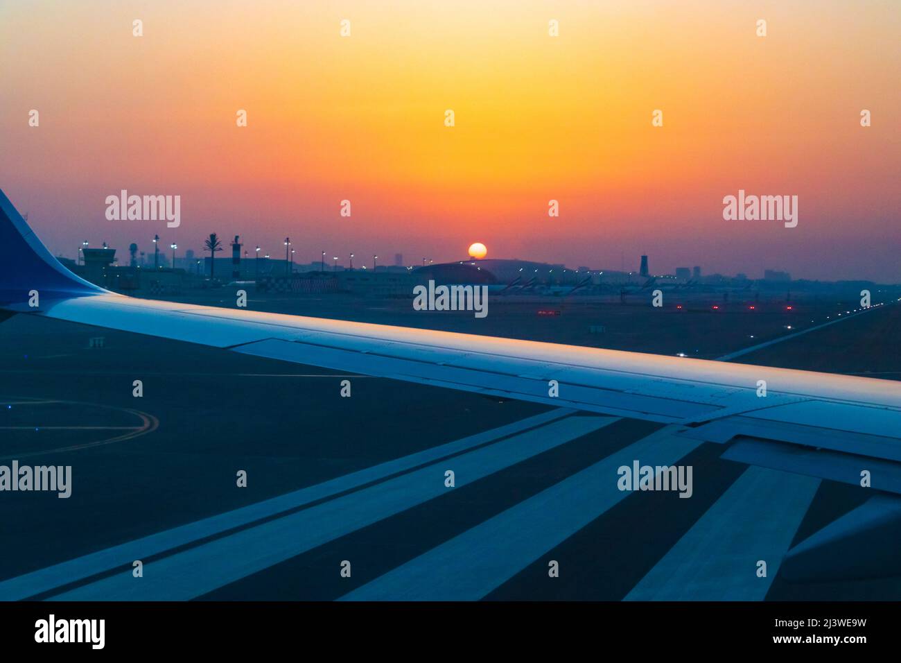 Sunset over Dubai International Airport runway,UAE Stock Photo - Alamy