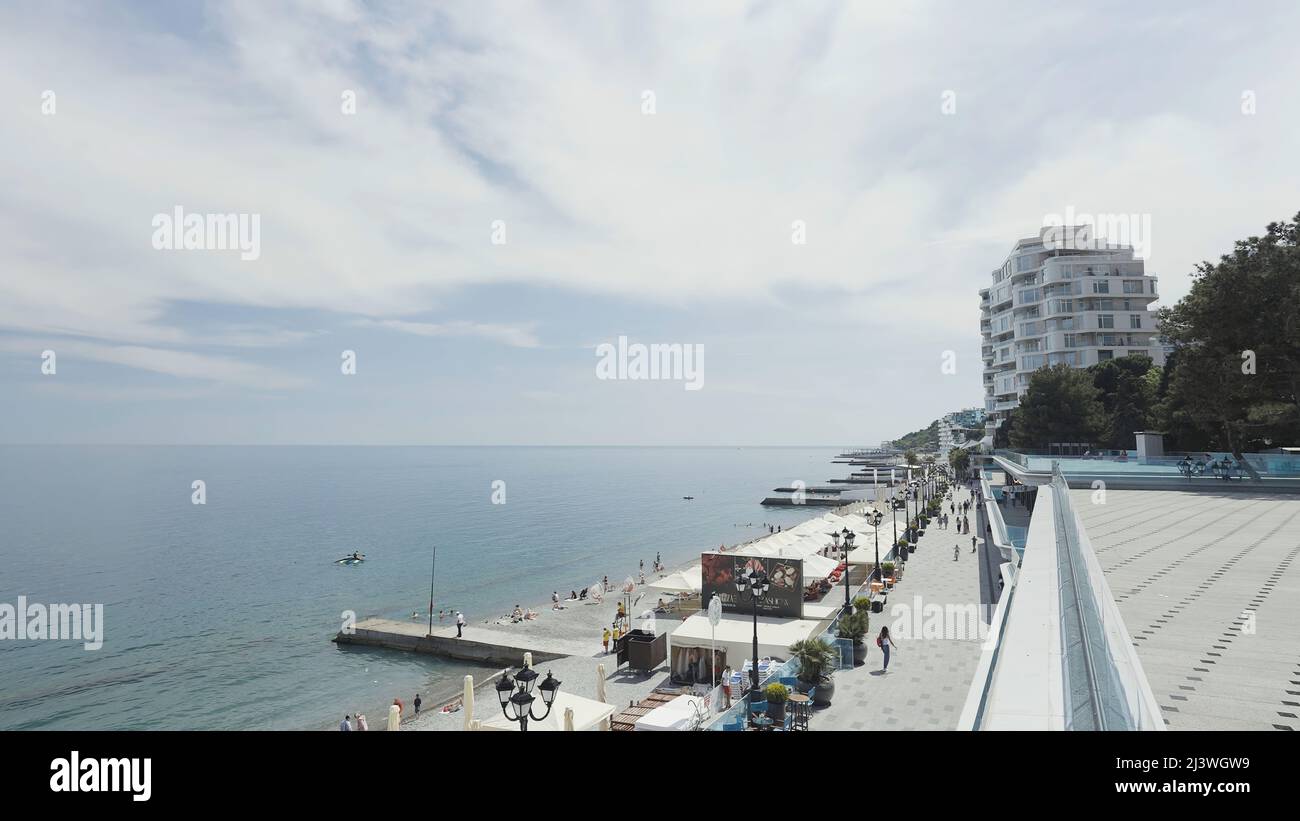 Panorama of resort embankment on sunny day. Action. Clean embankment ...