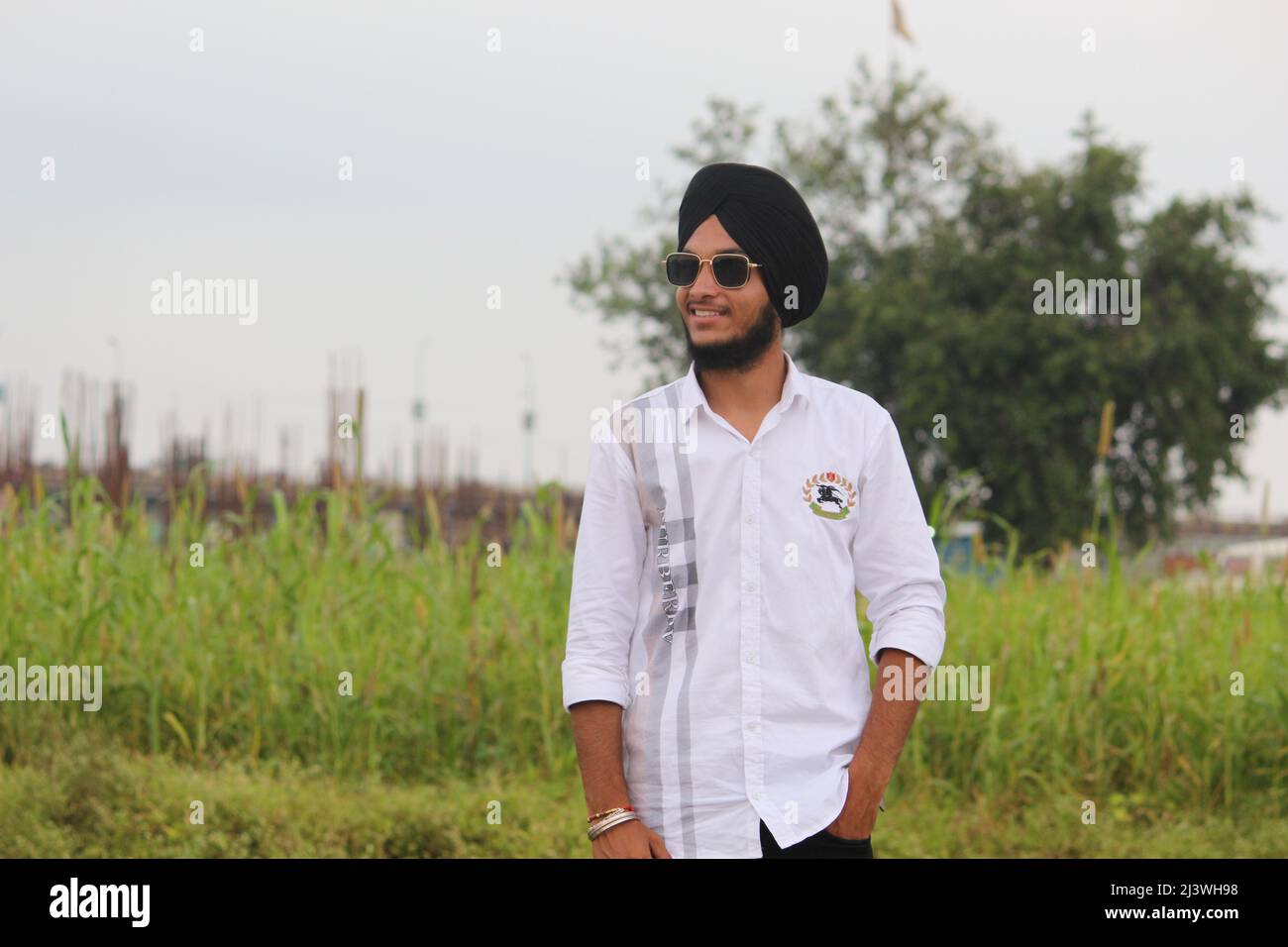 portrait of Young happy Indian sikh handsome man with smile, Mumbai ...