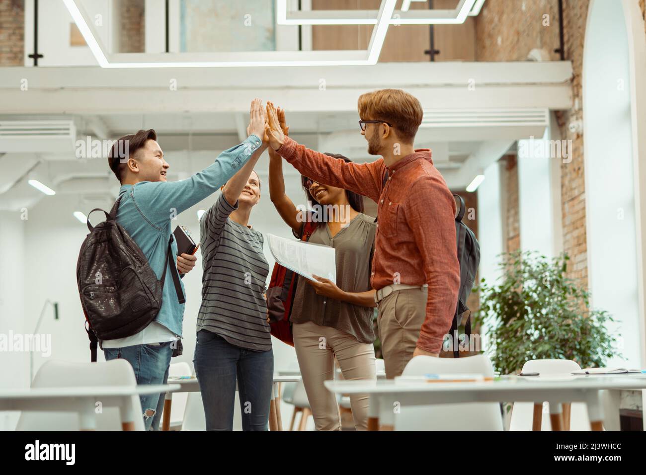Diverse group students celebrating hi-res stock photography and images ...