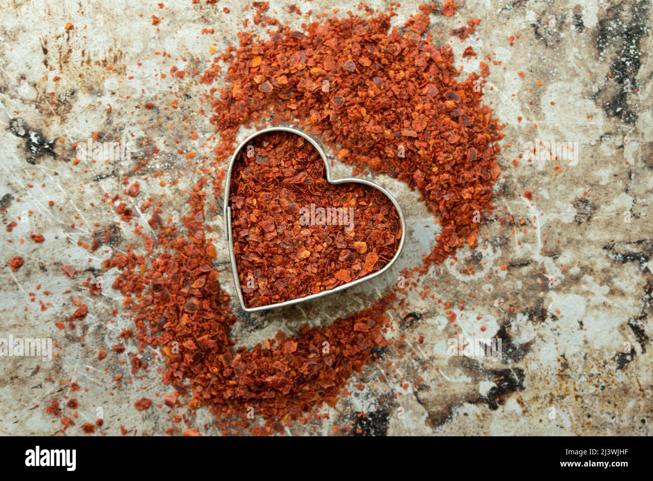 Aleppo Pepper Flakes in a Heart Shape Stock Photo - Alamy