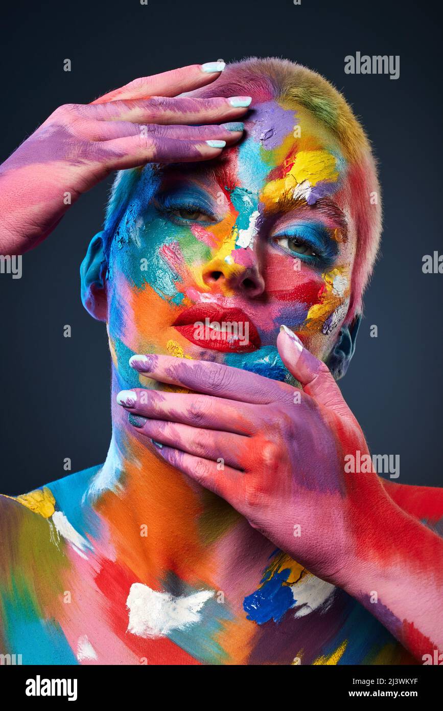 Color is all about expression. Studio shot of a young woman posing with ...