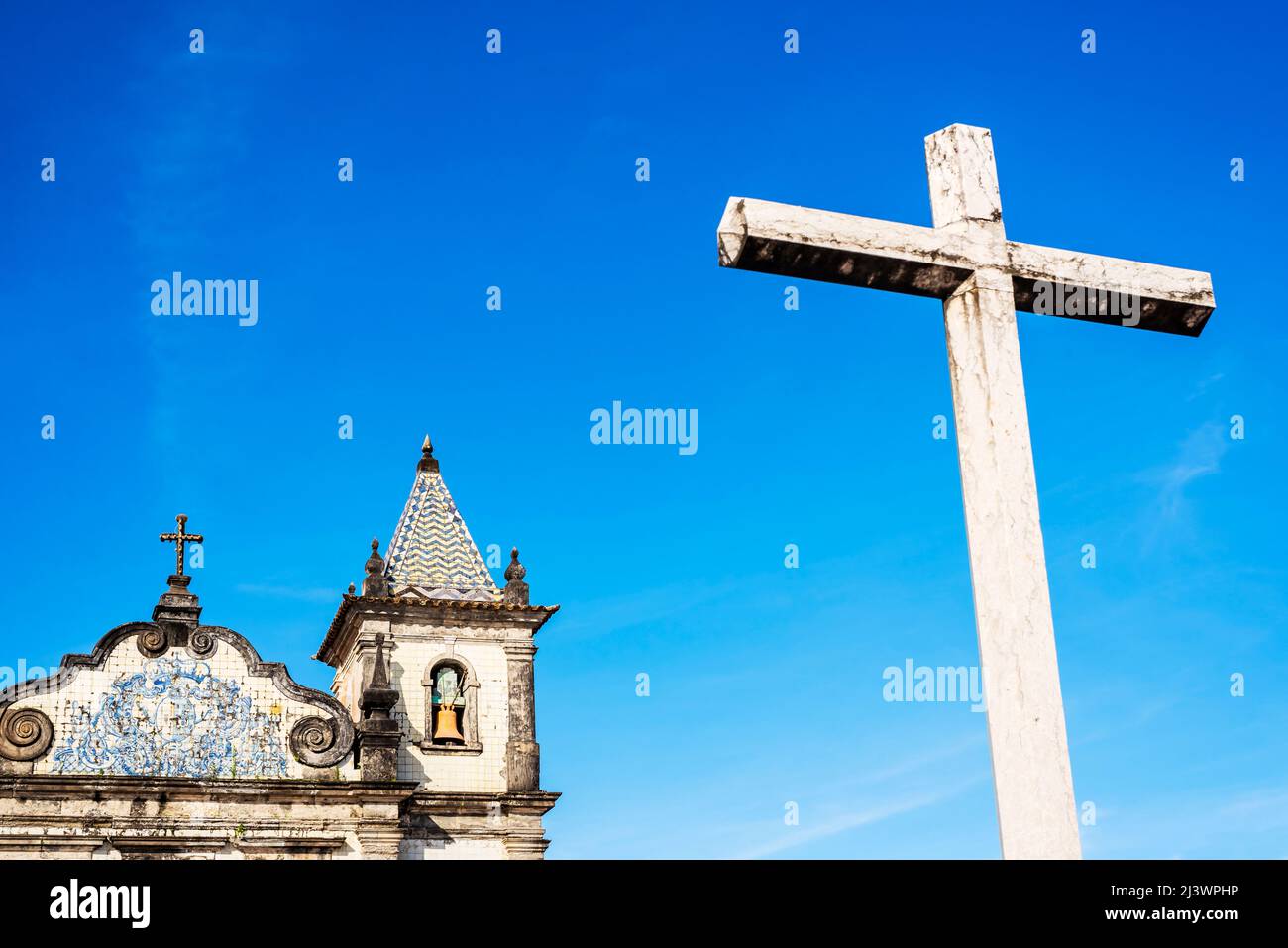 Cement cross of Boa Viagem church against blue sky. City of Salvador ...