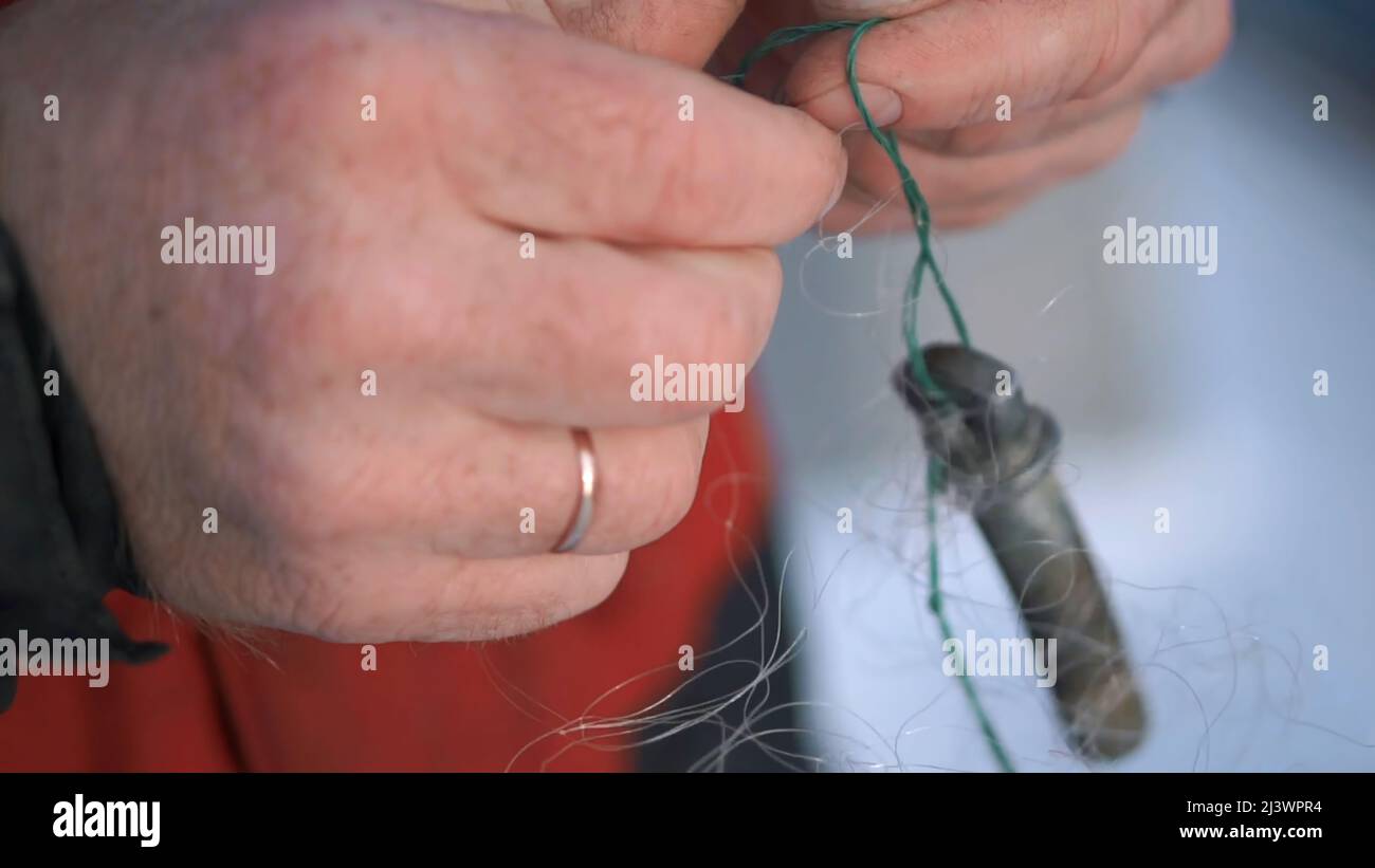 Strong male hands holding fishing hi-res stock photography and images ...