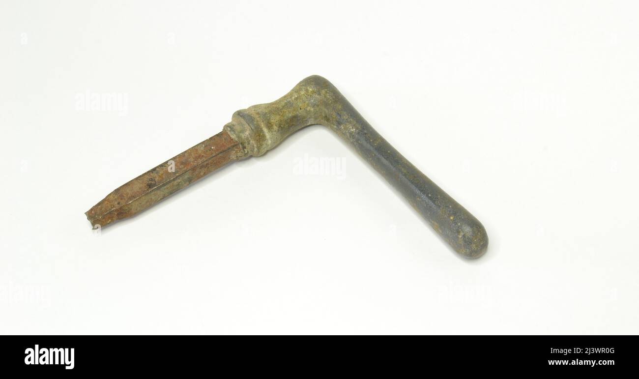 Antique metal door handle on gray background Stock Photo - Alamy