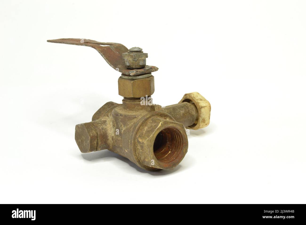 Vintage water ball valve on white background Stock Photo - Alamy