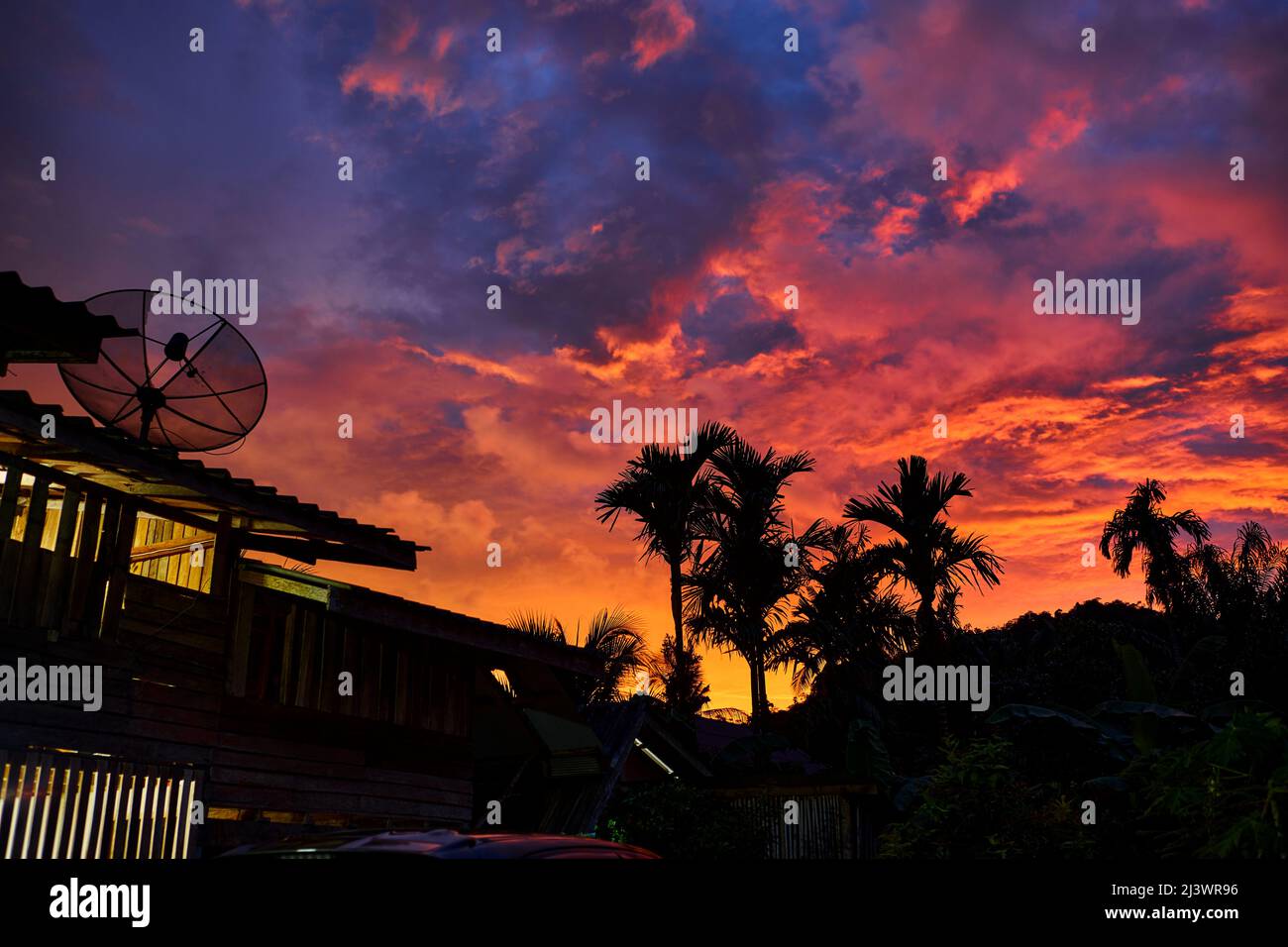 Vivid sky in sunset over home area Stock Photo - Alamy