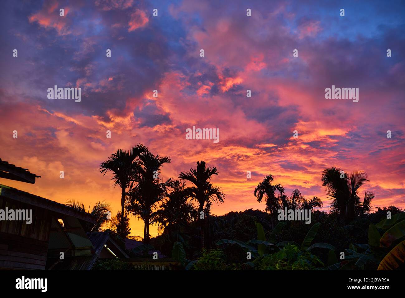 Vivid sky in sunset over home area Stock Photo - Alamy