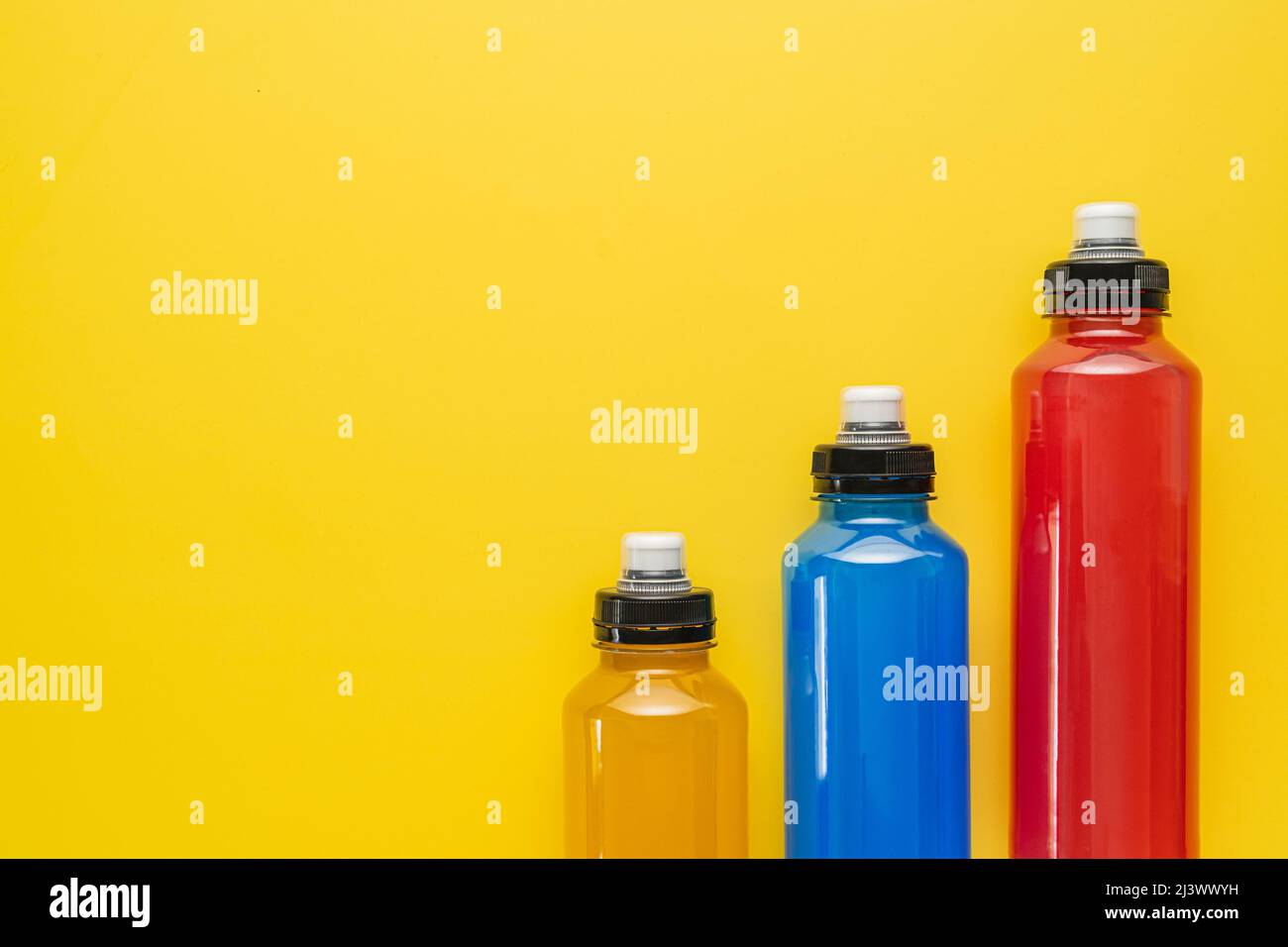 Isotonic energy drink. Bottle with blue and yellow transparent ...