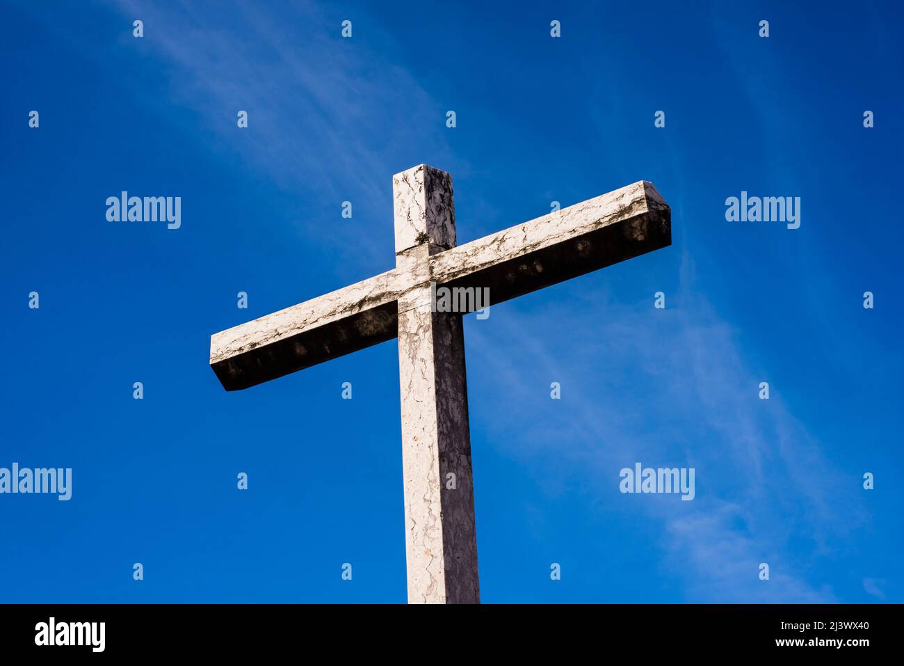 Catholic church cement cross against blue sky. City of Salvador ...