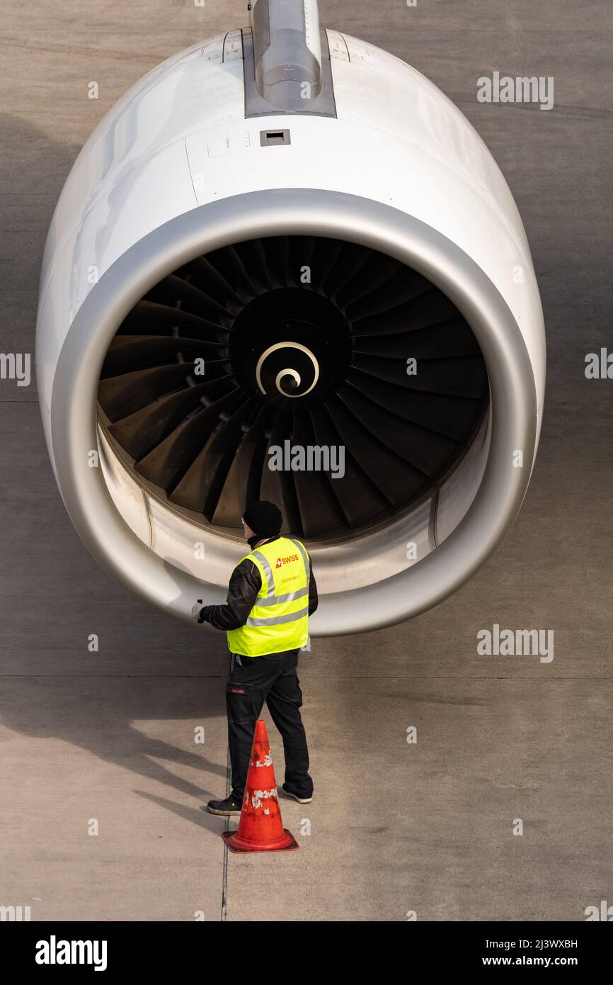 Zurich, Switzerland, March 2, 2022 An employee is checking the engine ...