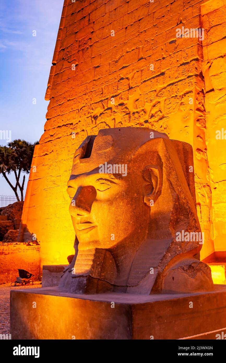 Closeup view the Statue of Pharaoh Ramses II Head in front of the pylon ...