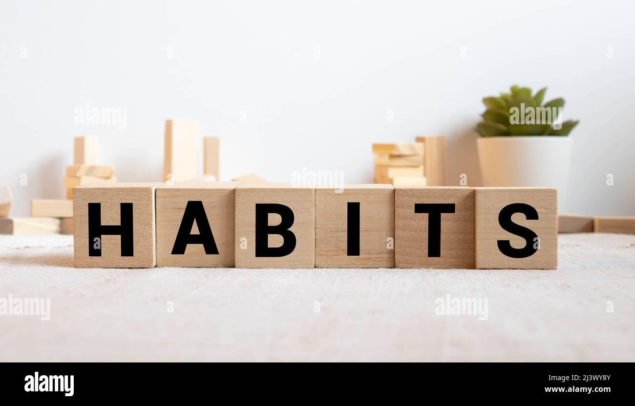 habits word written on wood block Stock Photo - Alamy