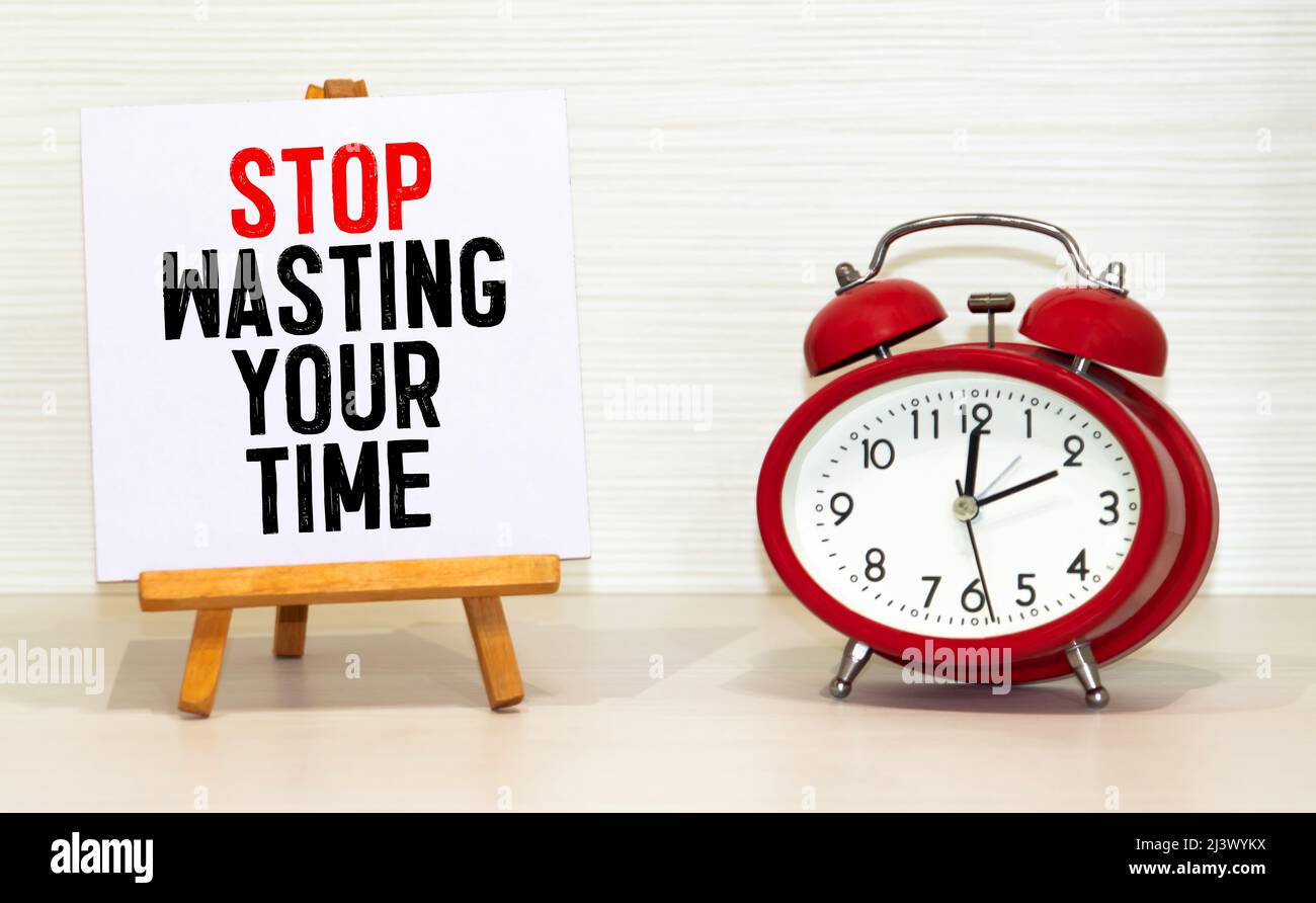 Don't Waste Your Time. Motivational concept written on easel Stock ...
