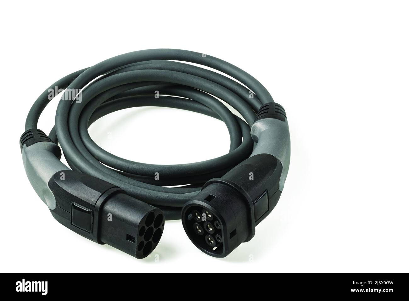 Close up view of black electric vehicle charging cable for outdoor use ...