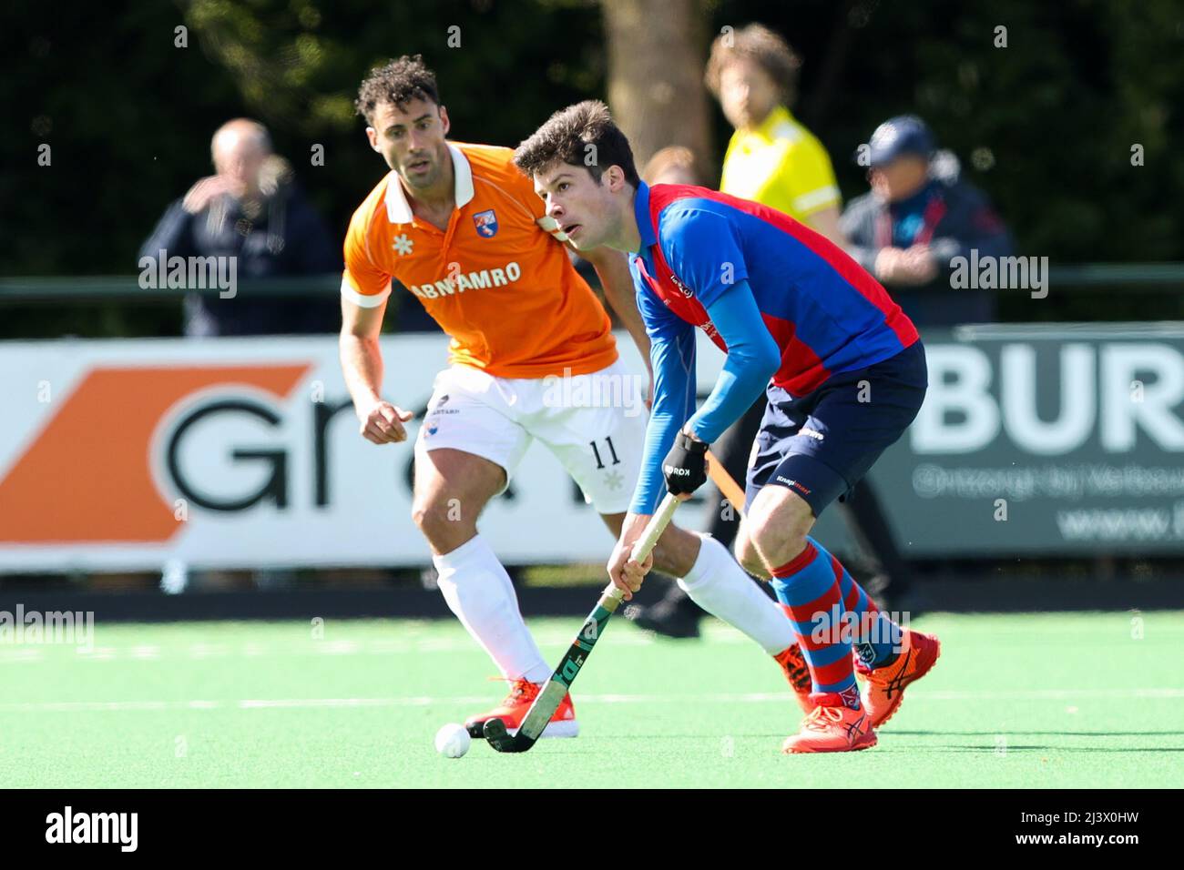 BILTHOVEN, NETHERLANDS - APRIL 10: Glenn Schuurman of Bloemendaal H1, Steef Stroeken of SCHC H1 ...