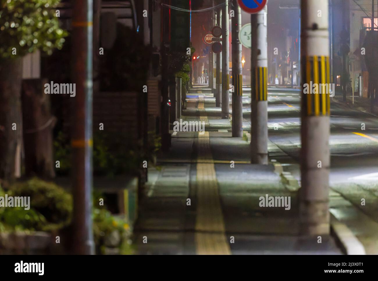 Streetlights illuminate empty side walk through mist at midnight Stock ...