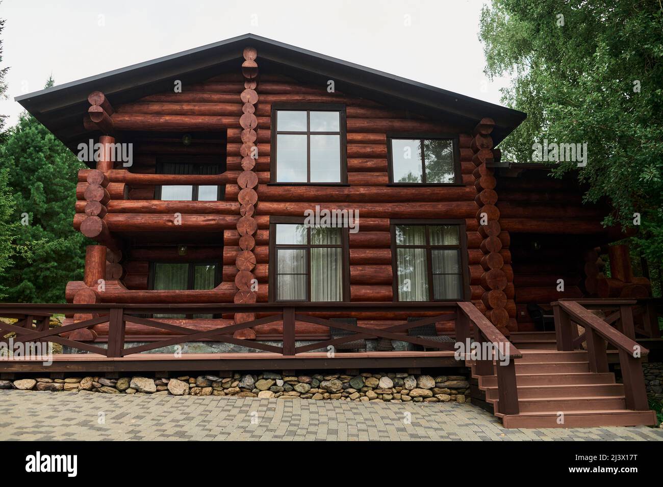 Wooden mountain house built from wood logs. Beautiful log house with ...