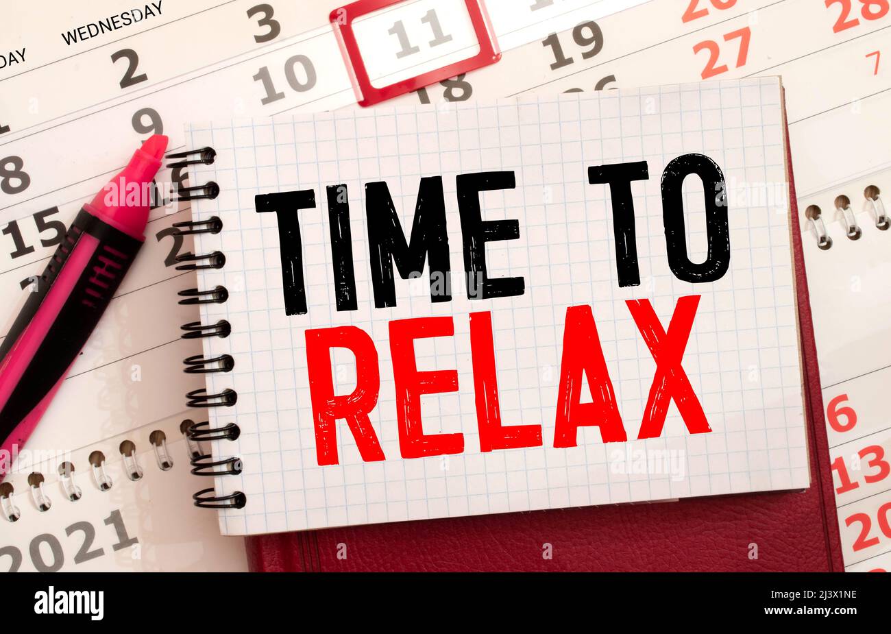 TIME TO RELAX text in notebook on gray background next to pencils and ...