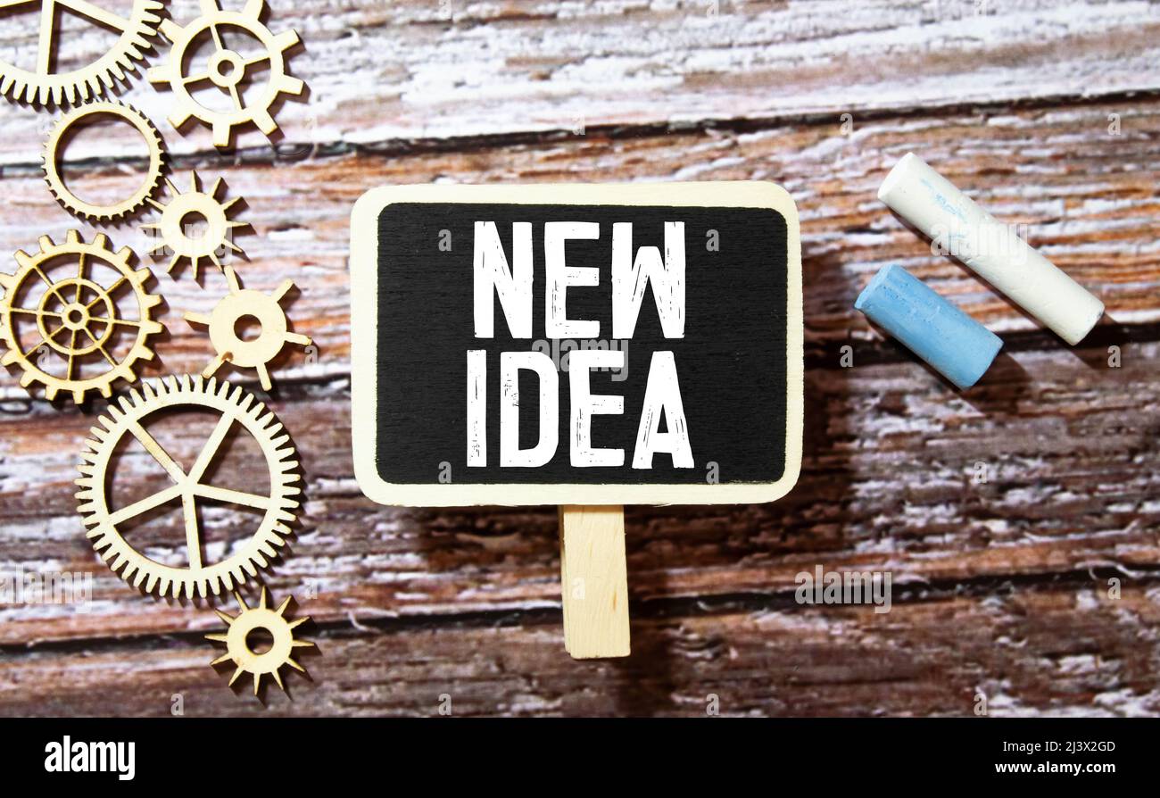 Business concept. Notebook with text new idea sheet of white paper for ...