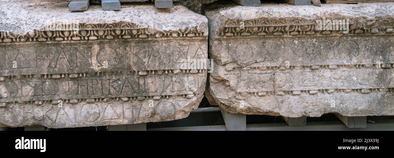 ruined construction of the old stone building with inscriptions in the ...