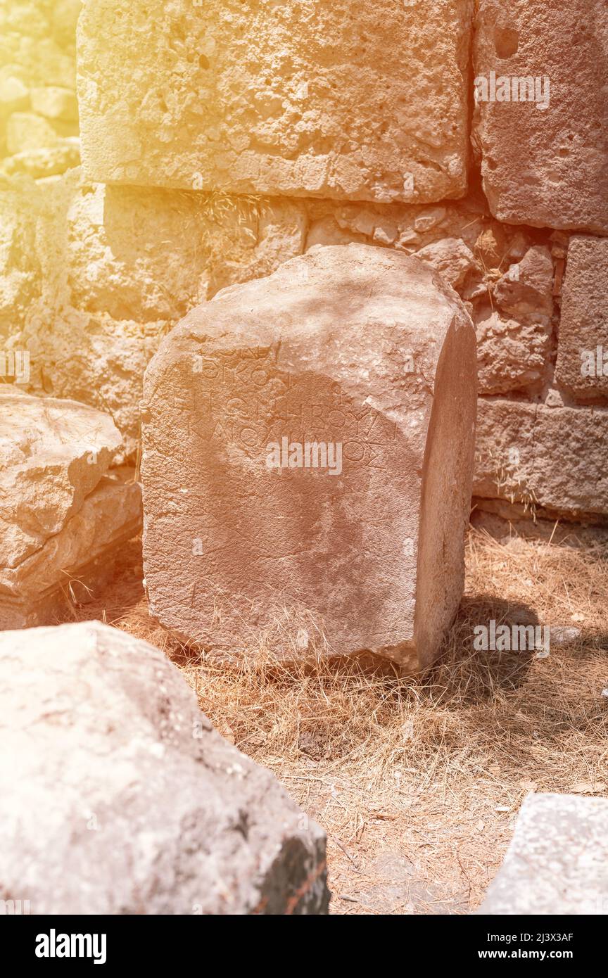 ruined construction of the old stone building with inscriptions in the ...