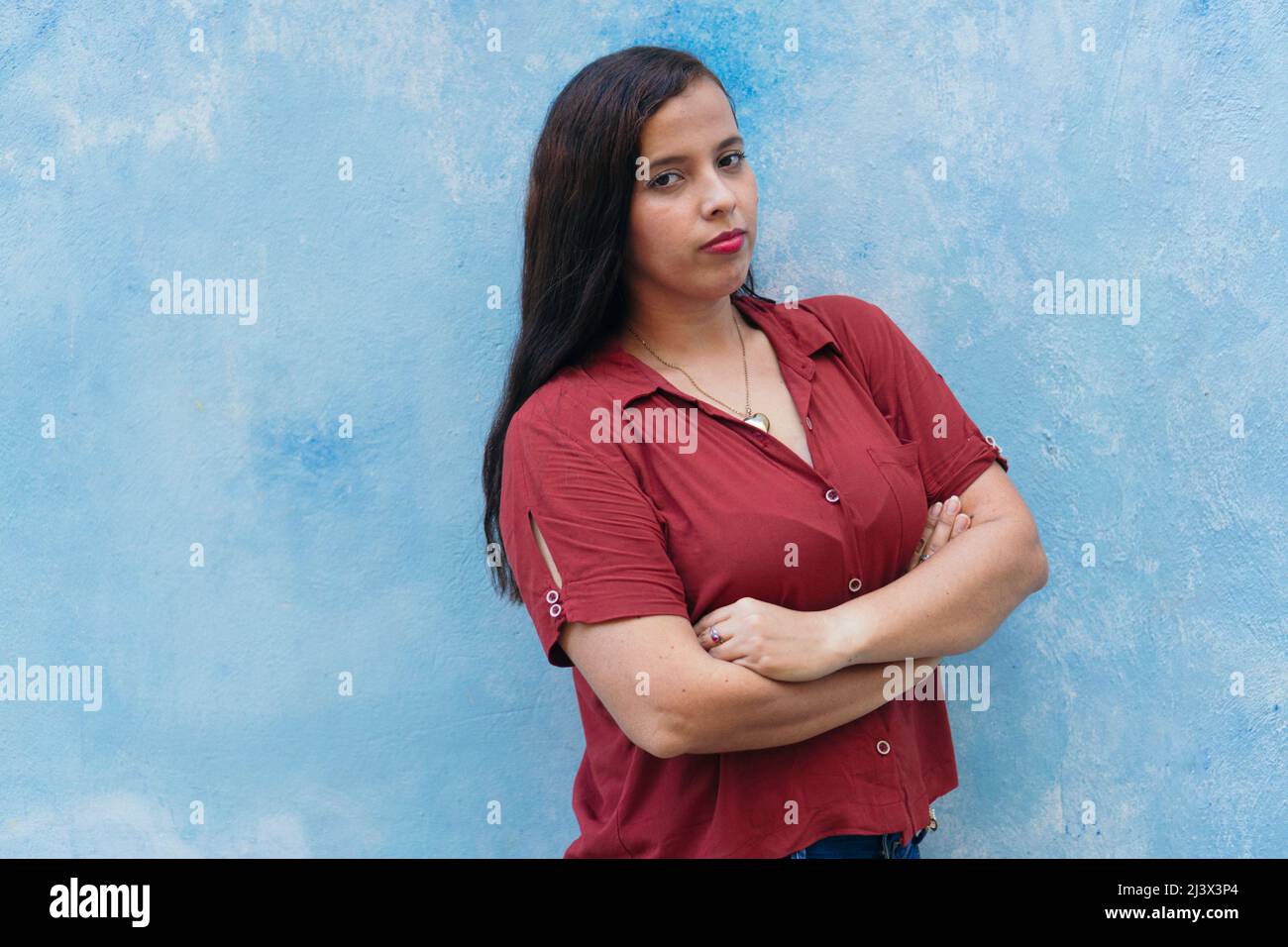 Woman with her arms crossed Stock Photo - Alamy