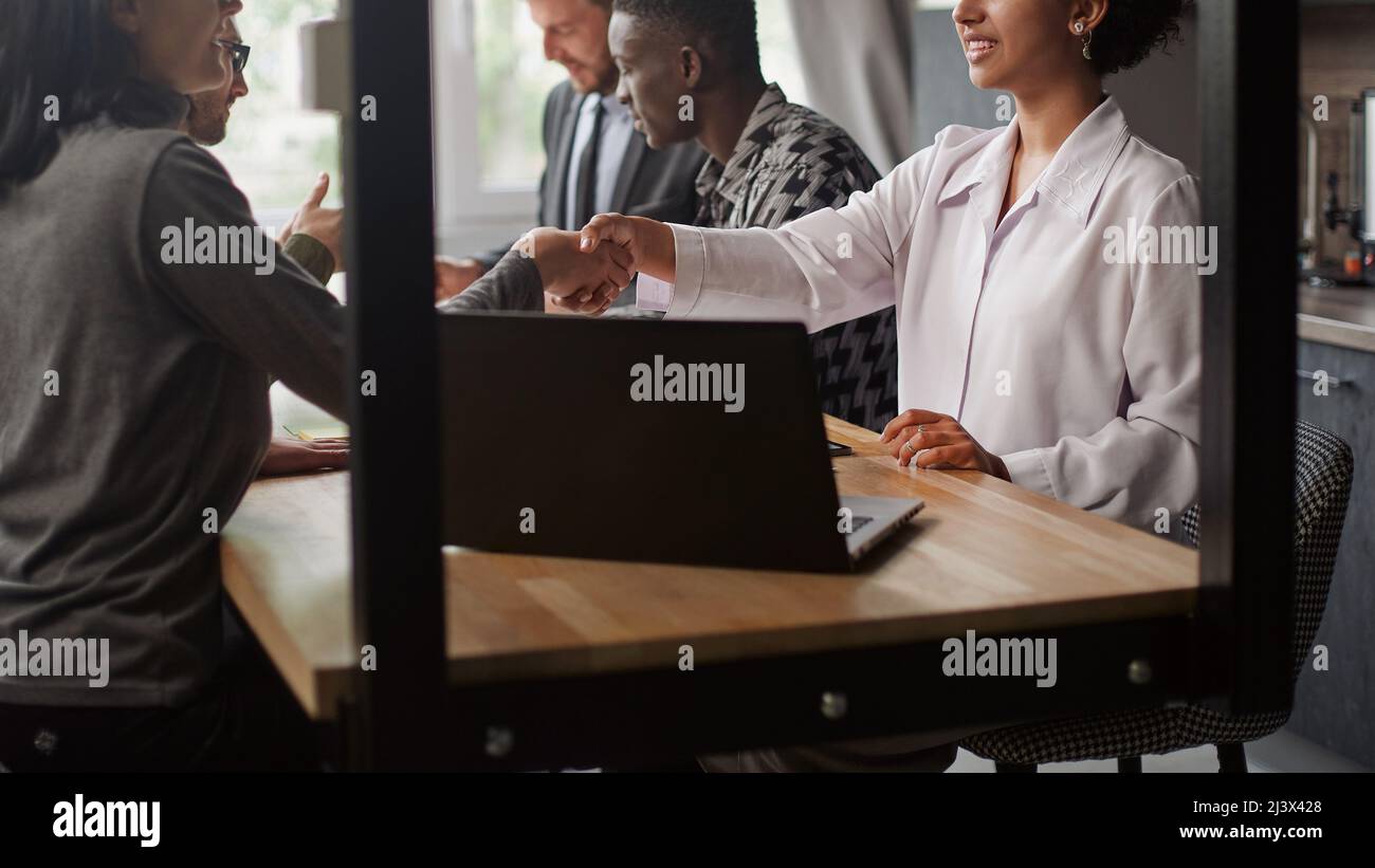 business woman greeting a client with a handshake Stock Photo - Alamy