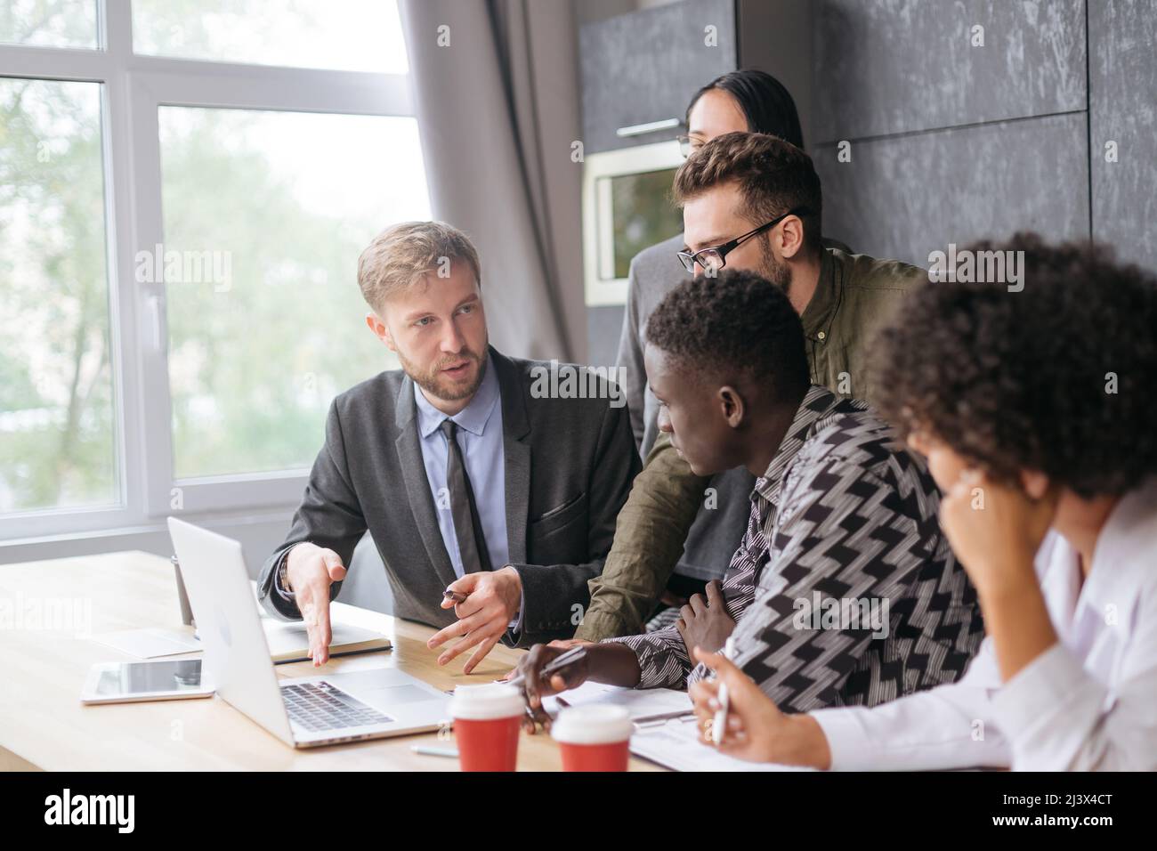business team at a meeting in the coworking center Stock Photo - Alamy
