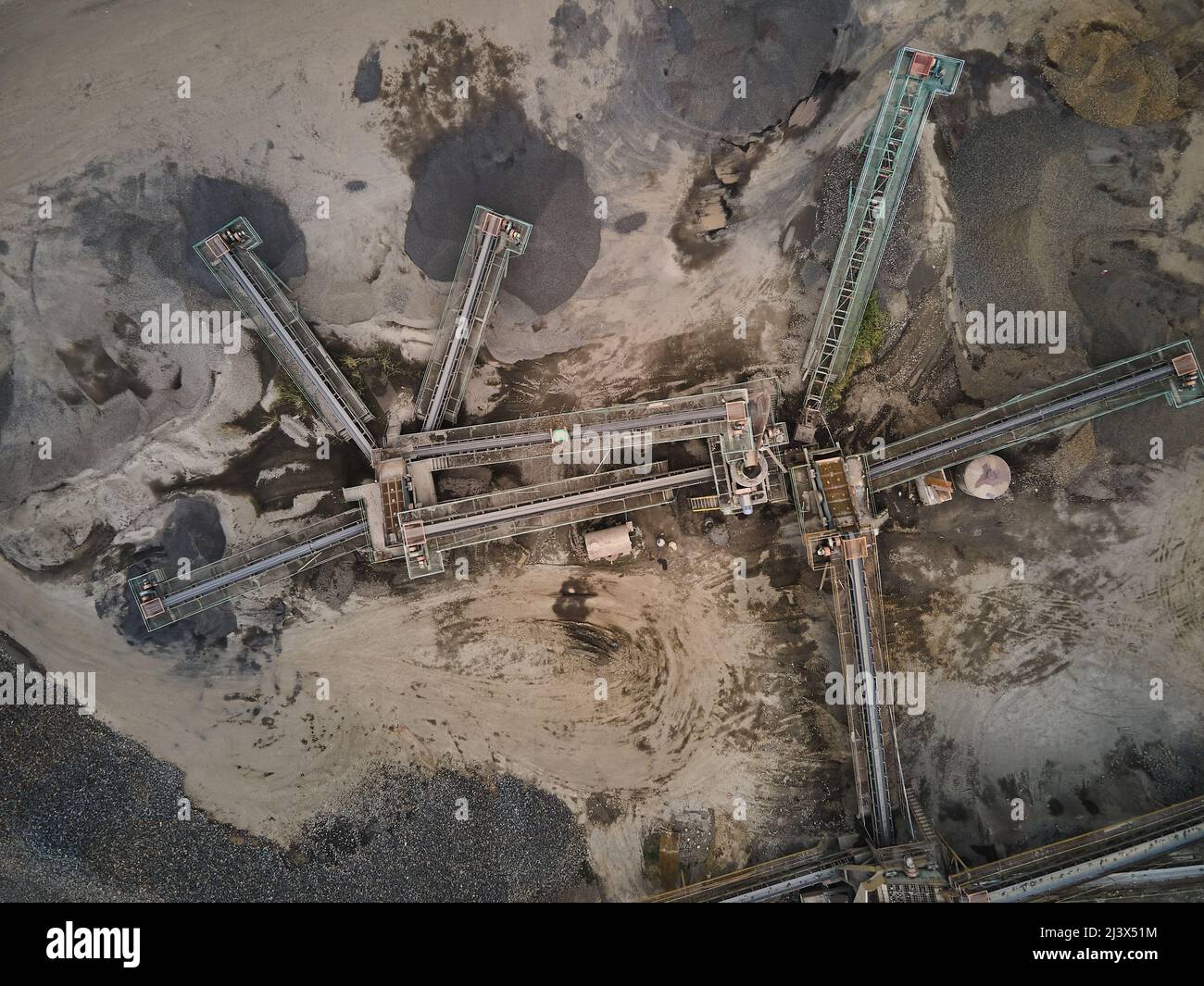 Aerial view basalt quarry of open pit mine machines with sifters and ...