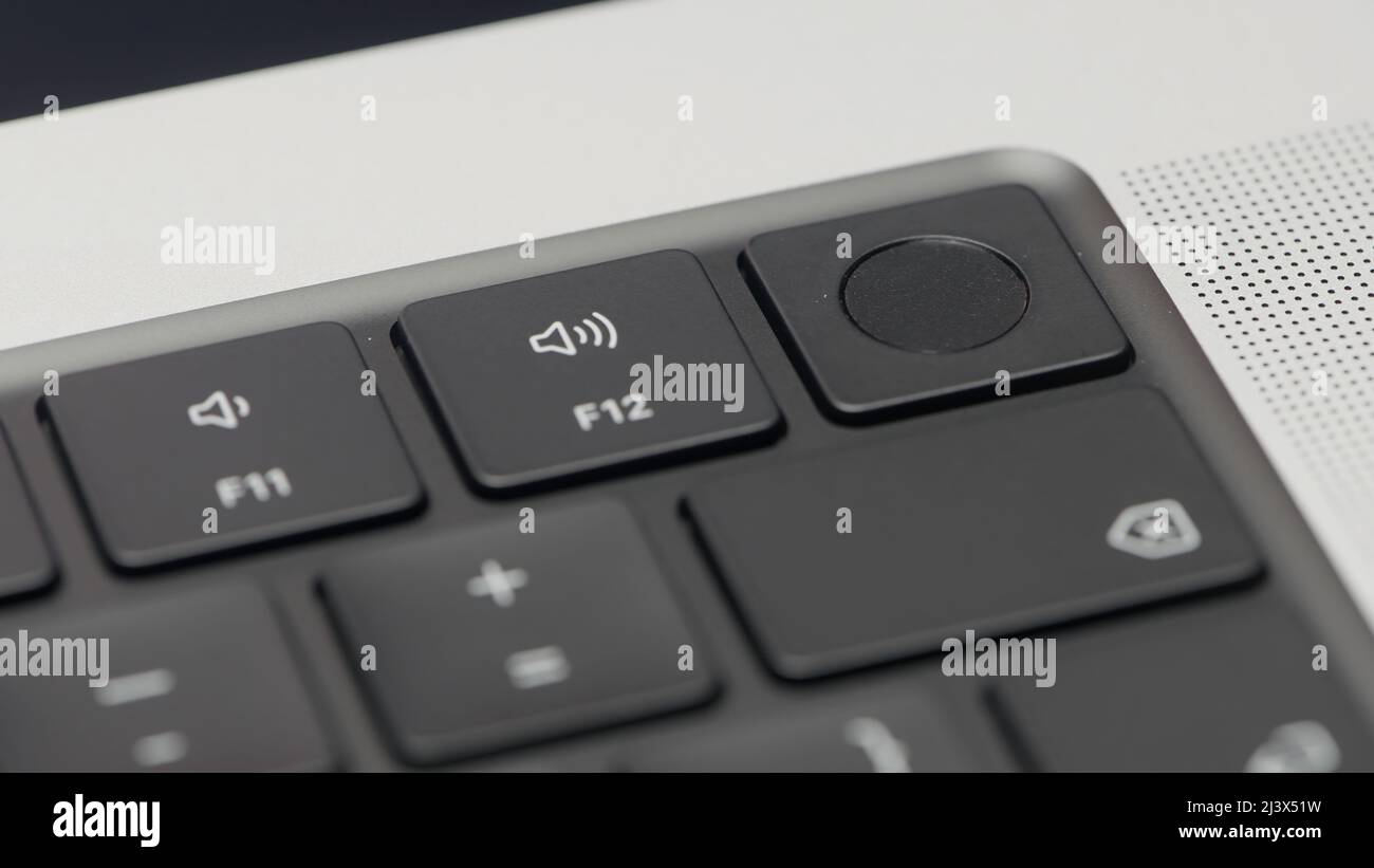 Laptop keyboard. Action. A person sits at a computer and works in ...