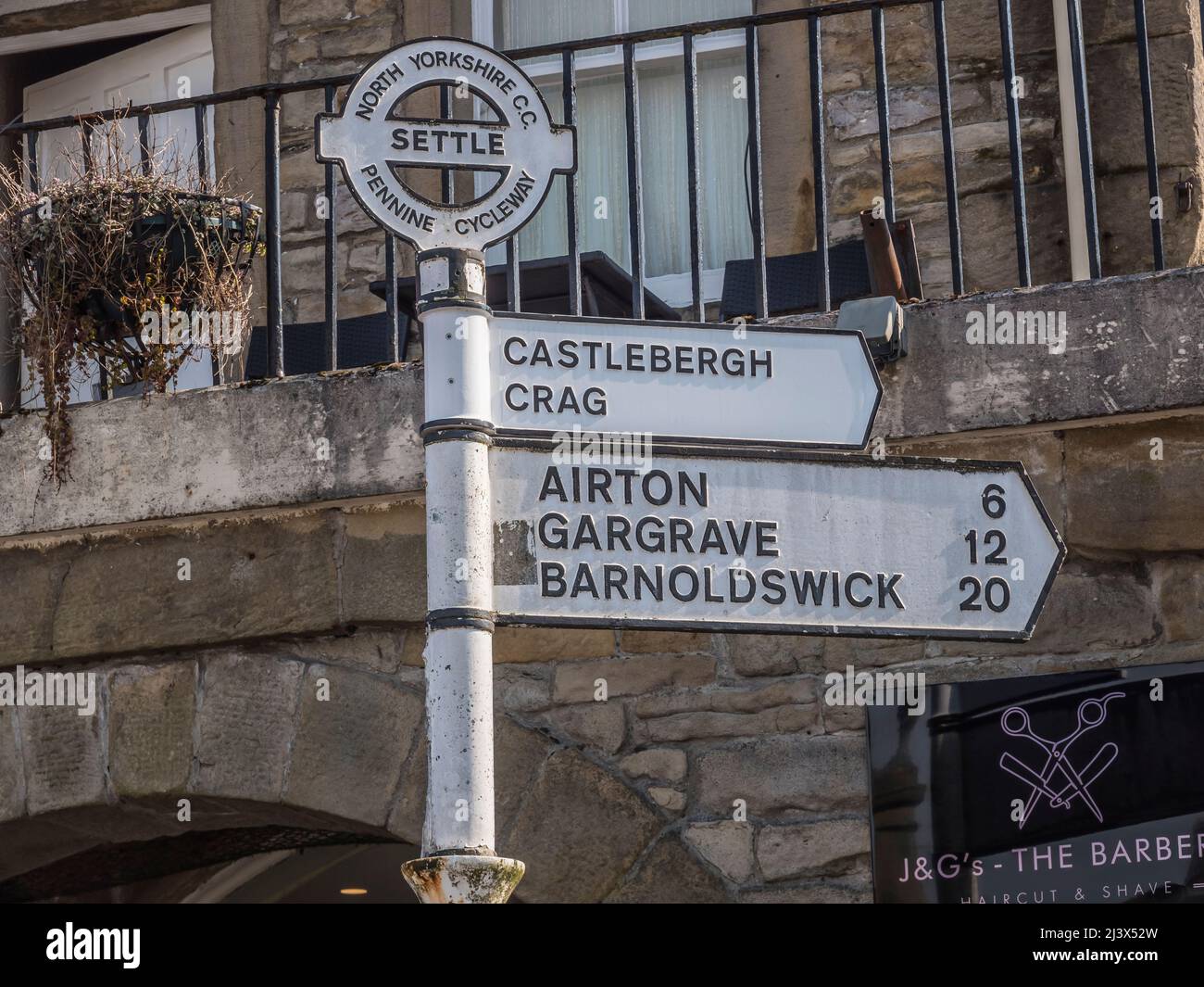 The image is of one of the old style finger post direction signs in the ...